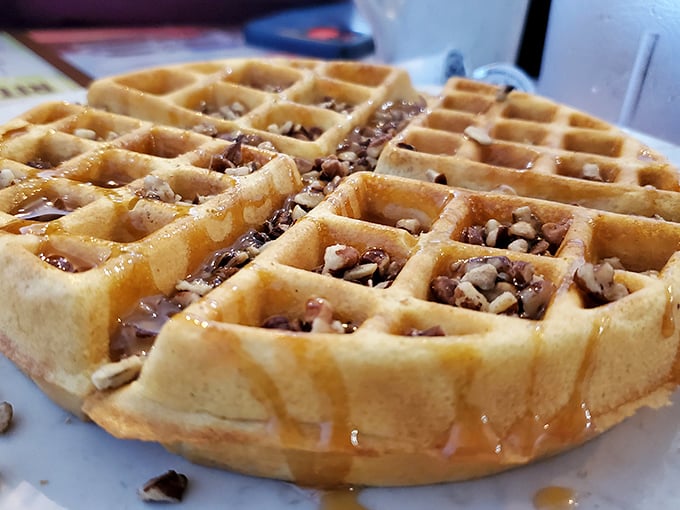 This isn't just any waffle—it's a pecan-studded masterpiece where every square holds the promise of buttery, maple-drenched bliss.