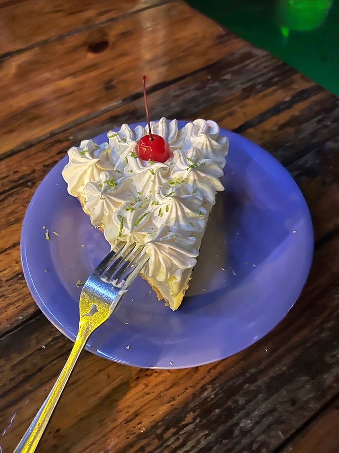 Key lime pie that strikes the perfect sweet-tart balance. That little cherry on top isn't fooling anyone—this slice is deliciously serious business.