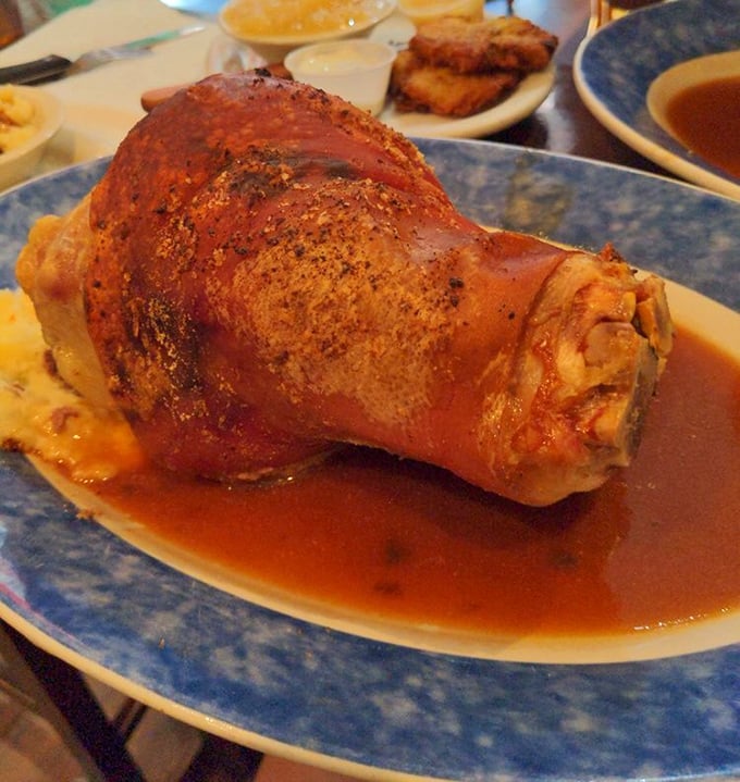 This pork shank isn't just dinner – it's an edible monument to German engineering, tender meat falling off the bone.