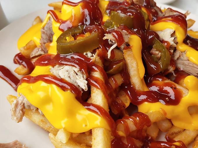 Porky fries – where french fries decided to dress for a night out with pulled pork, cheese sauce, and jalapeños. Diet plans, consider yourselves postponed.