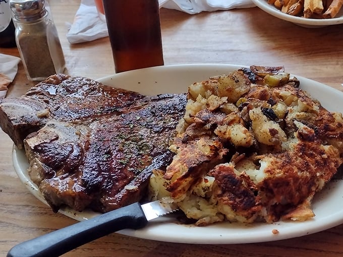 This porterhouse steak with crispy potatoes isn't just dinner—it's a carnivore's dream that would make Ron Swanson weep with joy.