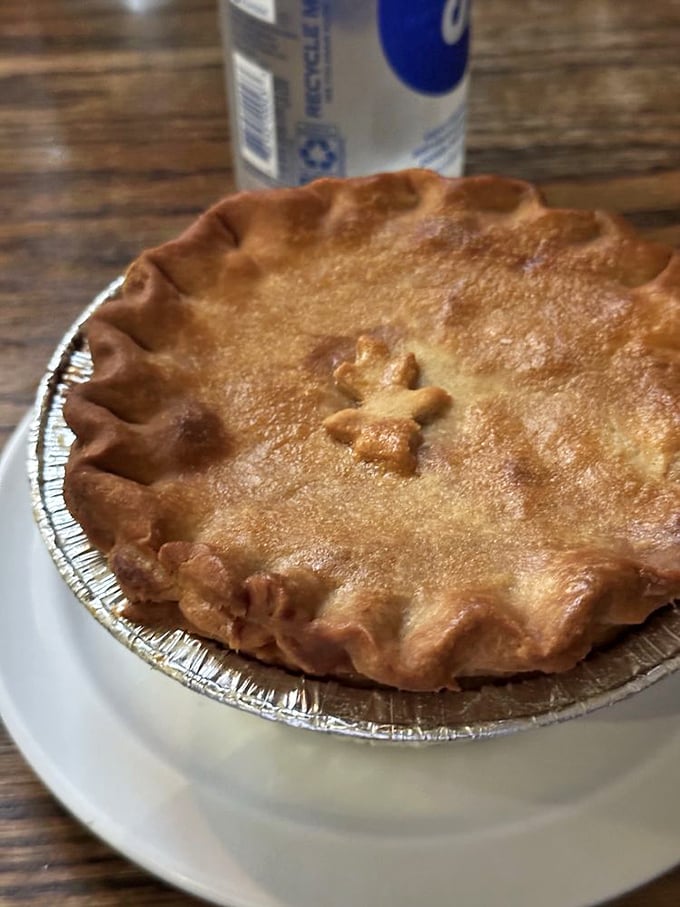 Golden-brown crust with that perfect crimp—this pot pie isn't just food, it's edible architecture with a steam vent for dramatic effect.