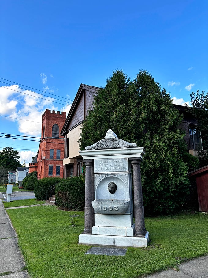 History stands sentinel in stone – this 1903 monument near a historic church reminds us that small towns treasure their past in ways big cities often forget.
