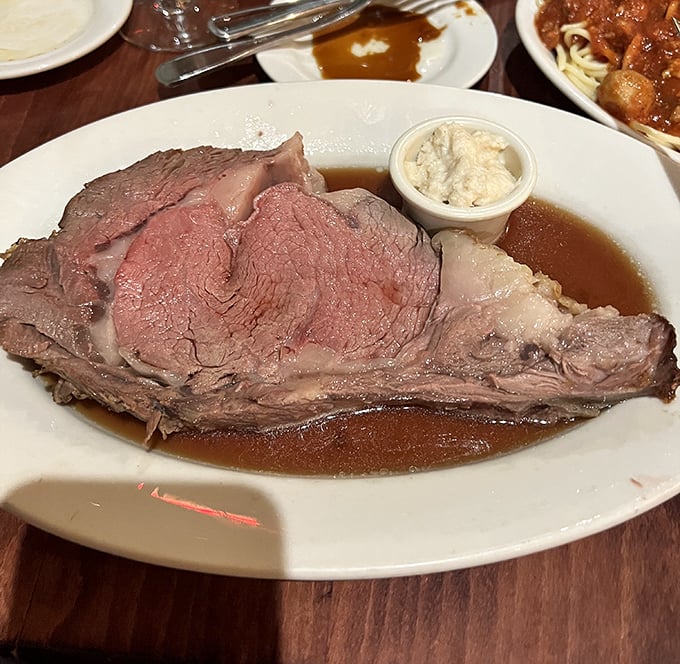 Prime rib that doesn't just speak – it sings a carnivorous love song, perfectly pink and accompanied by its natural juices like nature intended.