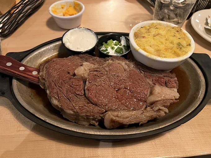 Prime rib presented on its throne—a sizzling metal platter—accompanied by horseradish sauce that clears sinuses you didn't know you had.