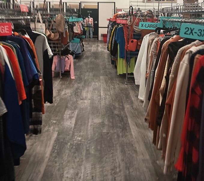 The fashion equivalent of library stacks—narrow pathways leading to unexpected discoveries. Size markers: the Dewey Decimal System of thrift.