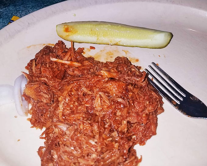 This pulled pork doesn't just fall apart—it practically surrenders to your fork, having given itself fully to the slow-cooking process.
