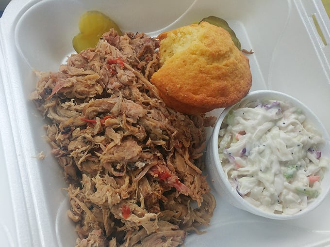 Pulled pork that doesn't need a fancy introduction—just a willing mouth and maybe a napkin or twelve. The cornbread and slaw aren't mere sides, they're supporting actors in a meaty drama.