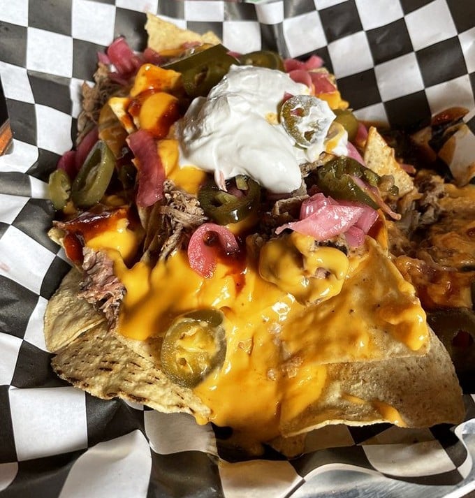 BBQ nachos that laugh in the face of utensils. A glorious mess of pulled meat, melted cheese, and jalapeños that's worth every napkin.
