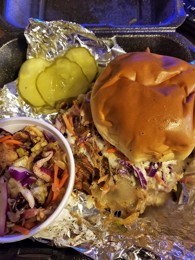 This pulled pork sandwich with pickles and slaw proves sometimes perfection comes wrapped in foil and pure smoky satisfaction.