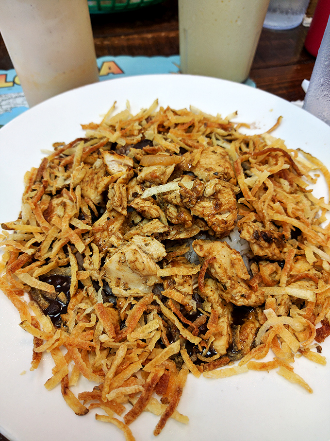 Not just pulled pork—it's a mountain of seasoned meat and crispy potato strings that makes you wonder why you ever ate anything else.
