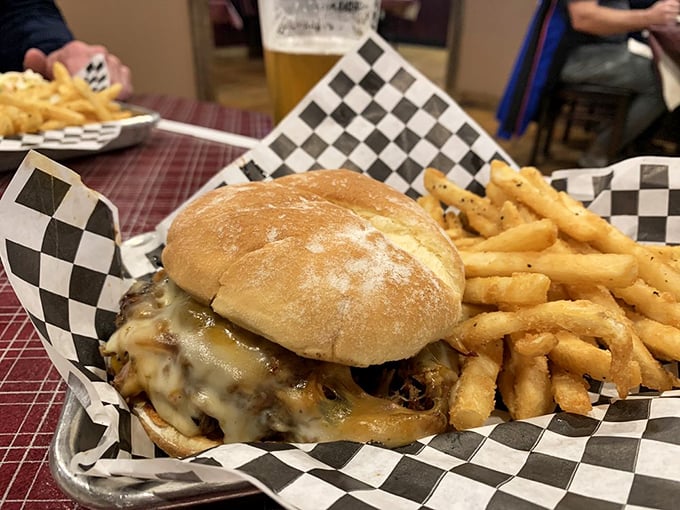 This isn't just a sandwich; it's an architectural marvel of melted cheese, tender pulled pork, and a bun that somehow maintains structural integrity against all odds. 