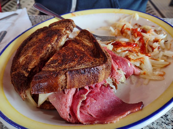 The Reuben at Gus's doesn't just satisfy hunger—it resolves existential crises. Corned beef stacked high enough to require jaw exercises before attempting.
