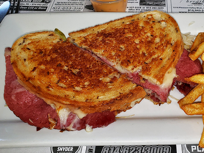 This Reuben isn't just a sandwich—it's architecture. Perfectly grilled bread creating a golden cathedral for that glorious corned beef congregation.