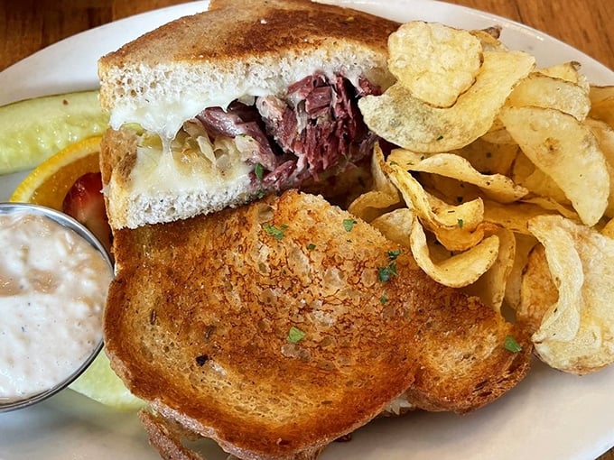This isn't just a sandwich; it's a masterclass in the art of the Reuben. The bread's golden crust practically winks at you.