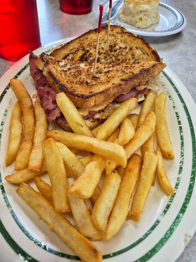 This sandwich isn't just grilled—it's been transformed into a masterpiece of melted cheese, tender meat, and golden bread that demands to be photographed first.