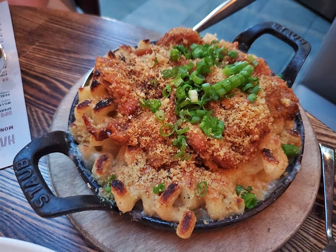 Mac and cheese gets the royal treatment with a crown of crispy breadcrumbs and green onions—comfort food that's dressed for a night out.