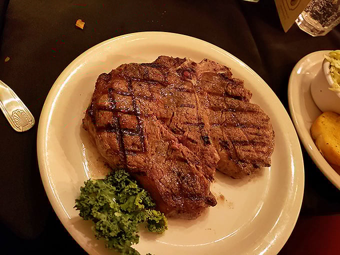 This ribeye isn't just dinner—it's an event. The perfect char outside, tender pink inside, and that little sprig of broccoli pretending it's the main attraction.