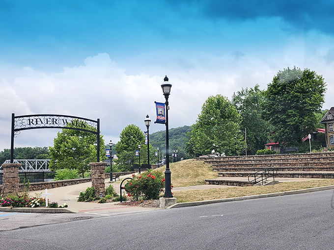 The Riverwalk entrance invites you to slow down and savor the simple pleasure of a riverside stroll—nature's antidote to inbox anxiety.