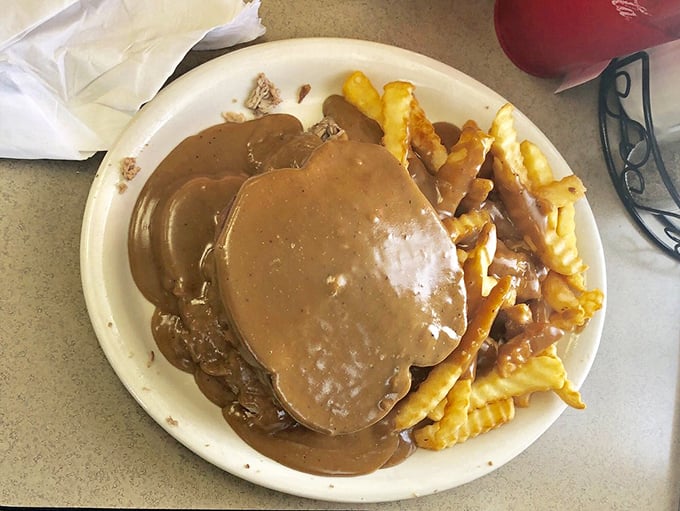 Comfort food perfection: hot roast beef smothered in gravy alongside golden fries—the kind of plate that makes Monday feel like Friday.
