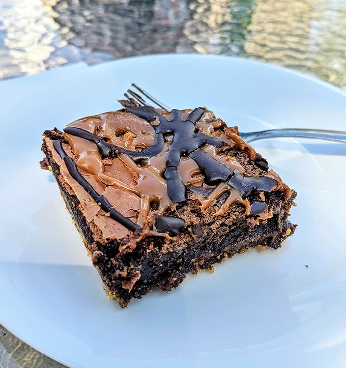 This salted caramel brownie doesn't just satisfy a sweet tooth – it creates a cult following and possibly minor religious experiences.
