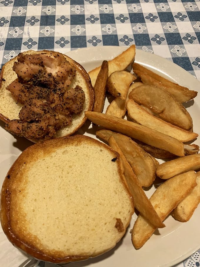 Even their sandwiches get the royal treatment – crispy chicken nestled on a bun with those hand-cut fries that put fast food chains to shame.