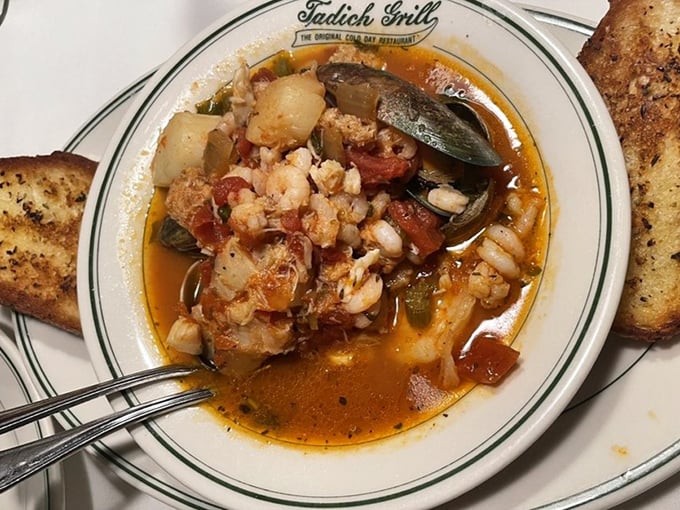 Cioppino that would make an Italian fisherman weep with joy – a tomato-based symphony of seafood that demands to be sopped up with sourdough.