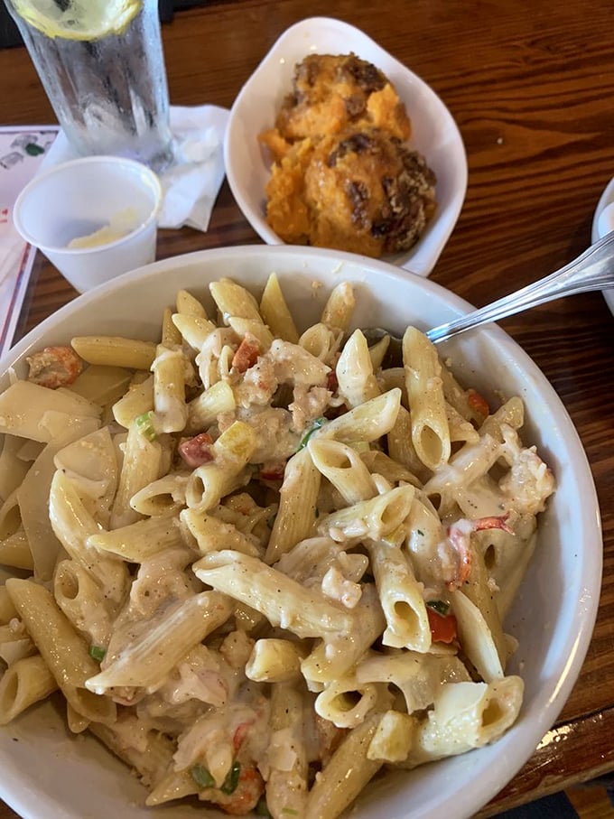 Pasta that doesn't know it's supposed to be Italian—penne swimming in creamy sauce with seafood treasures hiding between each bite.