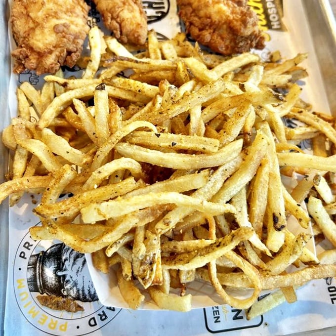 These aren't just fries—they're potato sculptures, hand-cut daily and seasoned with what I can only assume is some sort of happiness dust.