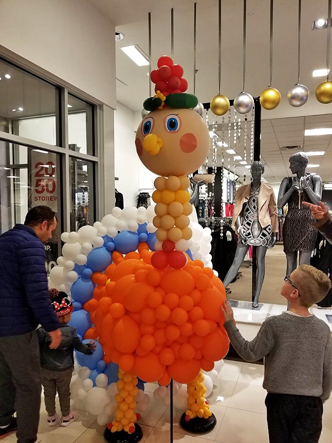 This whimsical balloon creation proves shopping centers aren't just for commerce—they're where childhood wonder meets parental credit card limits.