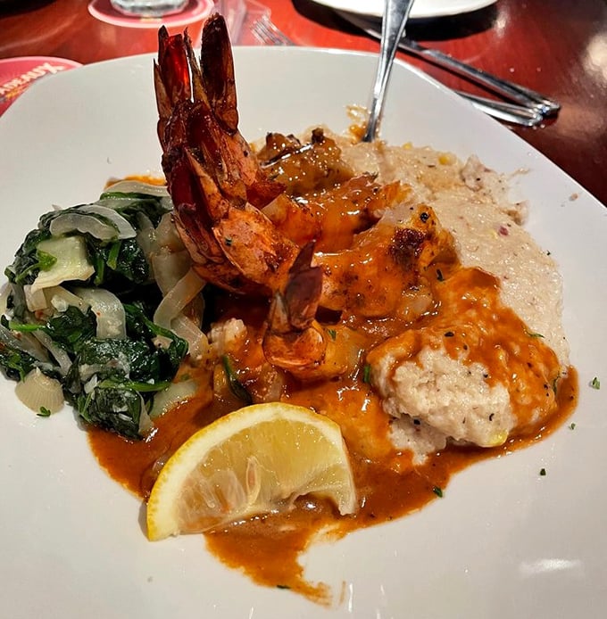 These shrimp aren't just resting on those grits—they're lounging like they've found the perfect beach chair on a culinary vacation.