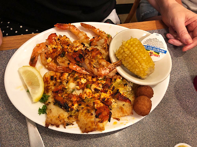 The Greek-style seafood here doesn't just cross borders—it demolishes them. Garlic, butter, and perfectly cooked shrimp create a Mediterranean vacation on a plate.
