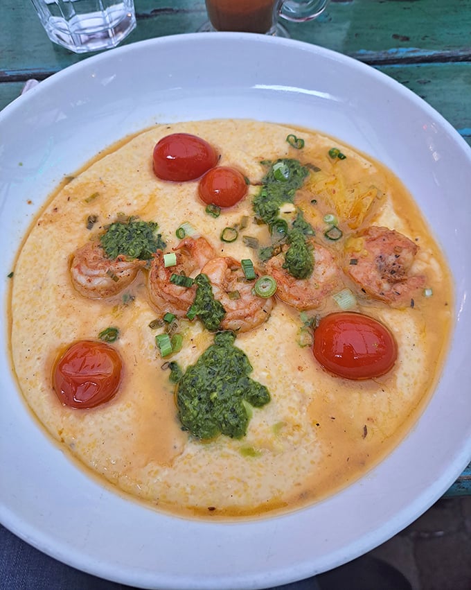 Creamy shrimp and grits that would make a Southerner nod in approval—bright tomatoes and fresh herbs adding pops of color and flavor to this comforting bowl.