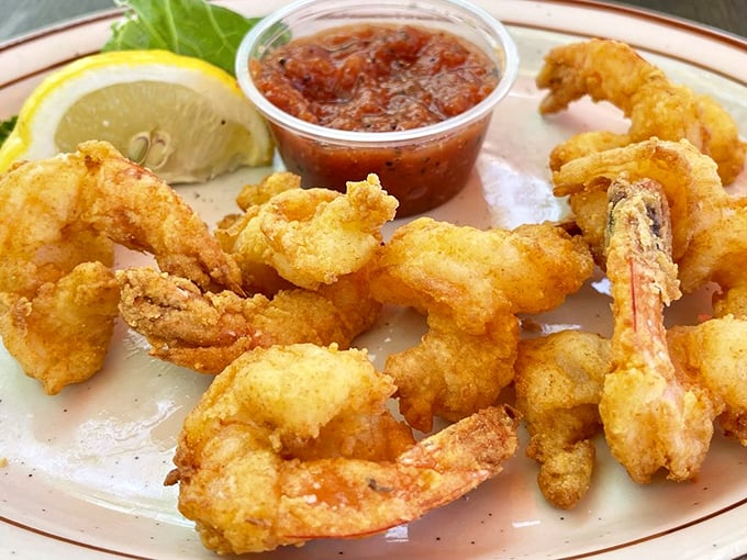 Fried shrimp so perfectly golden, they deserve their own trophy. That light, crispy batter is what other seafood shacks dream about at night.