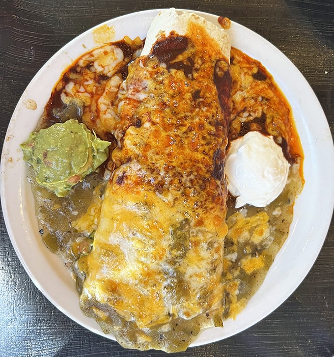 This burrito didn't just get smothered—it got lovingly enveloped in chile sauce, then tucked in with melted cheese and fresh guacamole.
