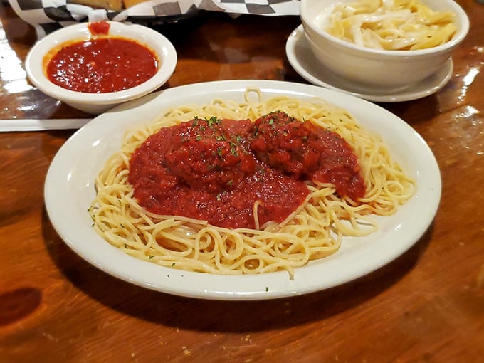 Spaghetti and meatballs done right—where the pasta has actual texture and the sauce tastes like it's been simmering since breakfast.