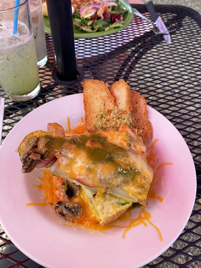This open-faced masterpiece on the patio comes with a side of New Mexico sunshine. The melted cheese blanket makes everything underneath taste like a celebration.