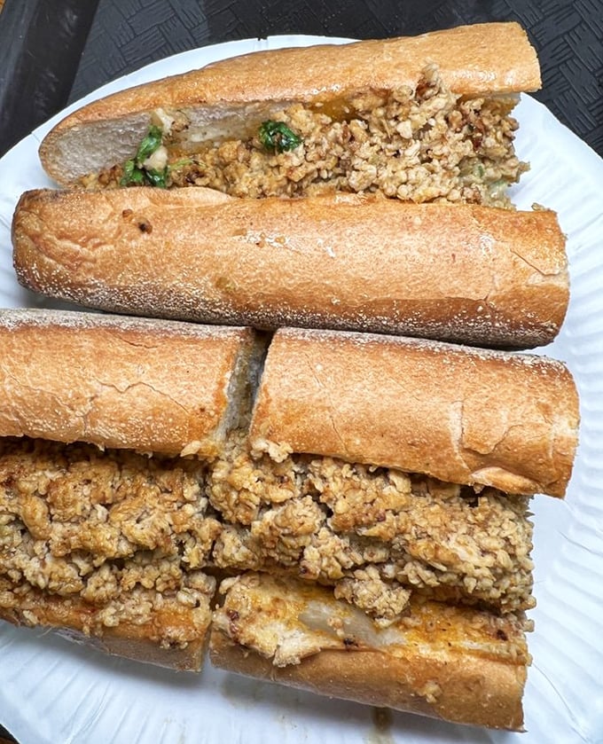 The spicy chicken cheesesteak – where traditional Philly meets bold international flavors. That golden-brown roll is practically begging to be devoured.