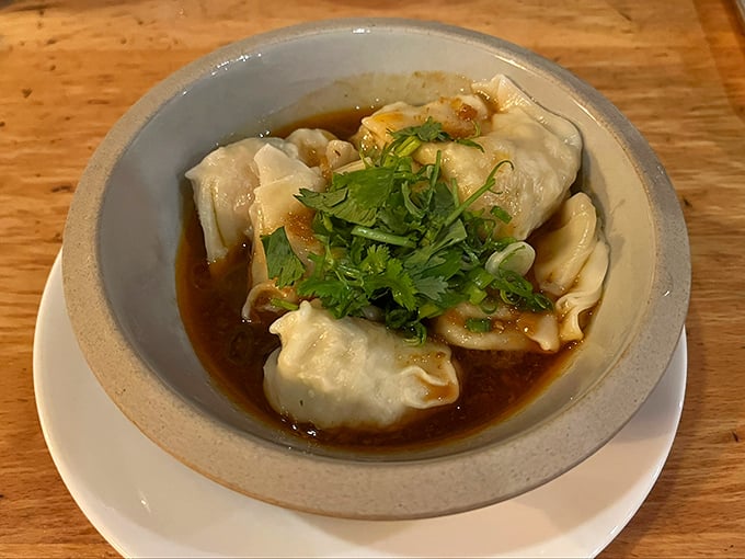 Swimming in a bath of savory broth, these plump shrimp wontons aren't just dumplings—they're little packages of joy waiting to be unwrapped by your eager chopsticks.