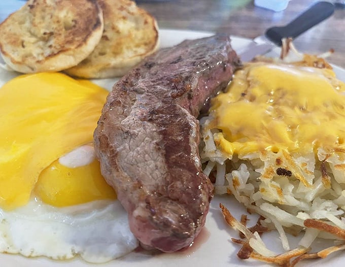 The breakfast of champions isn't cereal—it's this perfectly seared steak alongside sunny eggs and golden hashbrowns that make mornings worth facing.