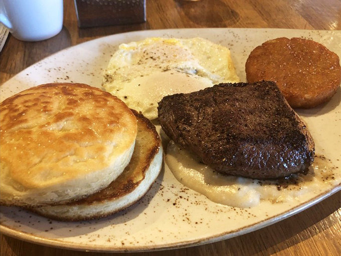 Breakfast of champions: a steak that didn't hit snooze, eggs cooked to perfection, and a biscuit that deserves its own fan club.