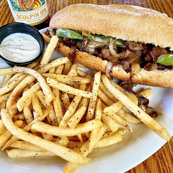 The legendary steak sandwich in all its glory—tender beef, caramelized onions, and perfectly toasted bread. A symphony of simplicity that hits all the right notes.