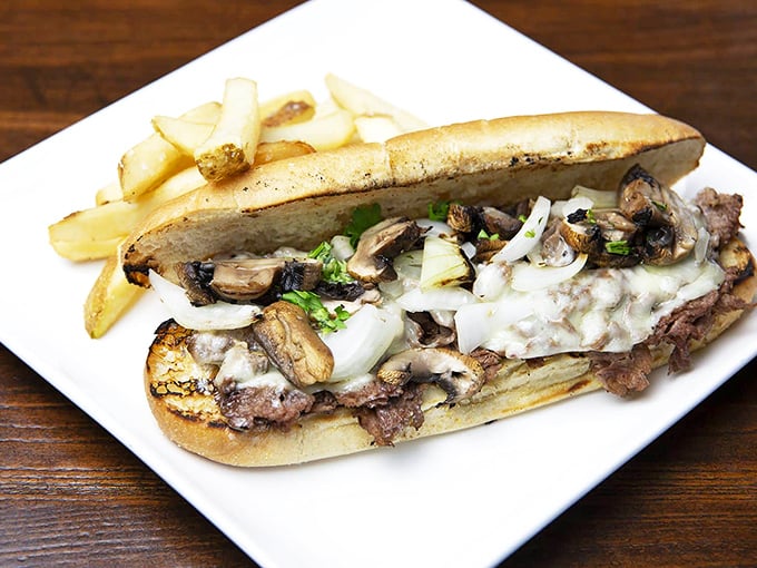 A steak sandwich with sautéed mushrooms and melted cheese that makes lunch feel like a special occasion.