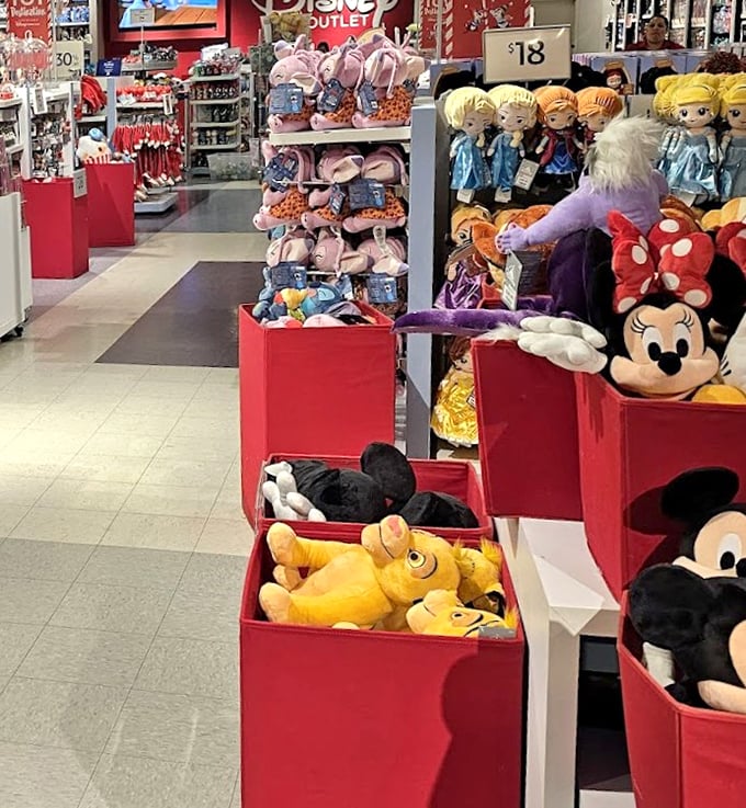 The Disney Store Outlet: where adults suddenly remember they "need" a Pluto plush "for the kids" while secretly planning where to display it at home.
