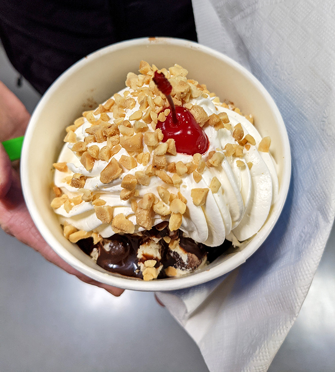 This sundae isn't just dessert, it's architecture—layers of ice cream, toppings, and whipped cream creating the Taj Mahal of sweet indulgence.