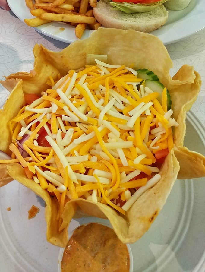 This isn't just a taco salad – it's an edible bowl of joy topped with a snowfall of cheese that makes vegetables feel like a celebration.