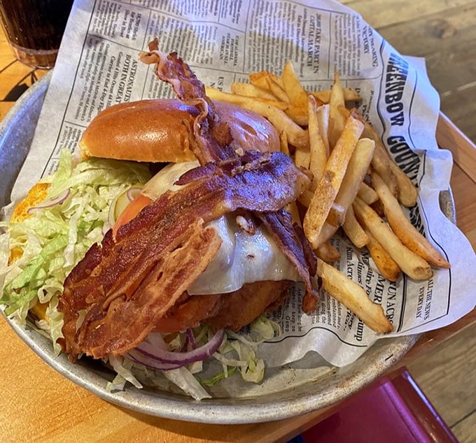 This isn't just a sandwich; it's a skyscraper of bacon, lettuce, and crispy goodness that requires a game plan before the first bite.