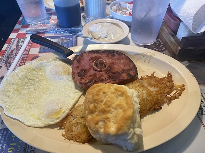 The Hog Wild breakfast isn't just a meal, it's a commitment—one that rewards your bravery with perfectly cooked eggs and a ham steak that means business.