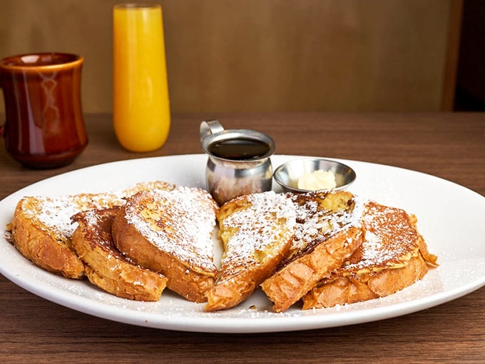 French toast that makes Wonder Bread look like a Cinderella story—transformed from humble beginnings into powdered-sugar royalty.