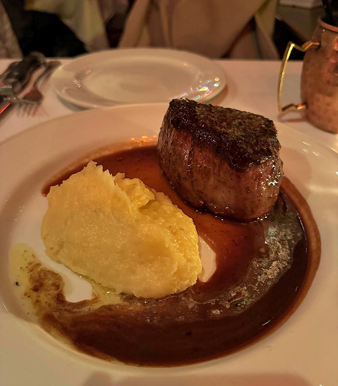 This filet doesn't just sit on the plate—it commands attention with a rich sauce that would make even vegetarians reconsider.